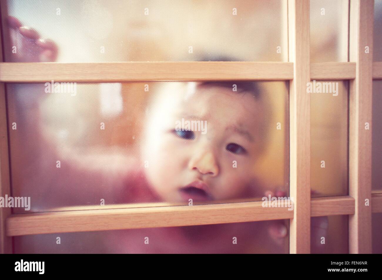 The boy behind the door hi-res stock photography and images - Alamy