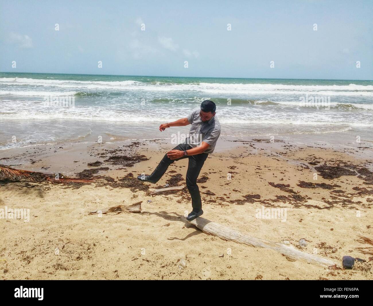 Man standing on beach hi-res stock photography and images - Alamy
