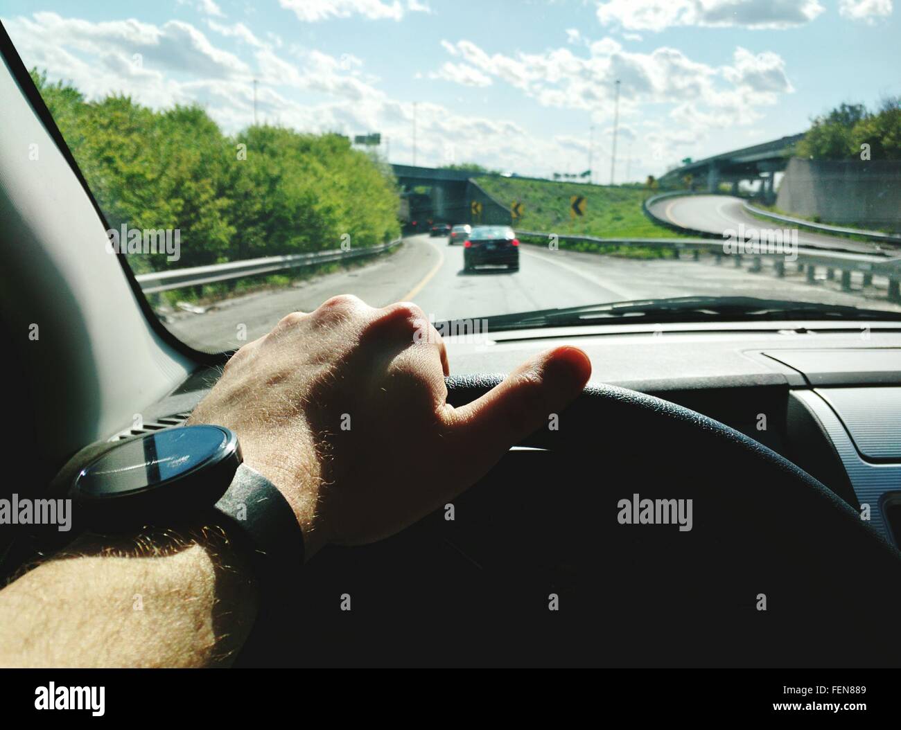 Cropped Image Of Man Riding Car On Street Stock Photo - Alamy