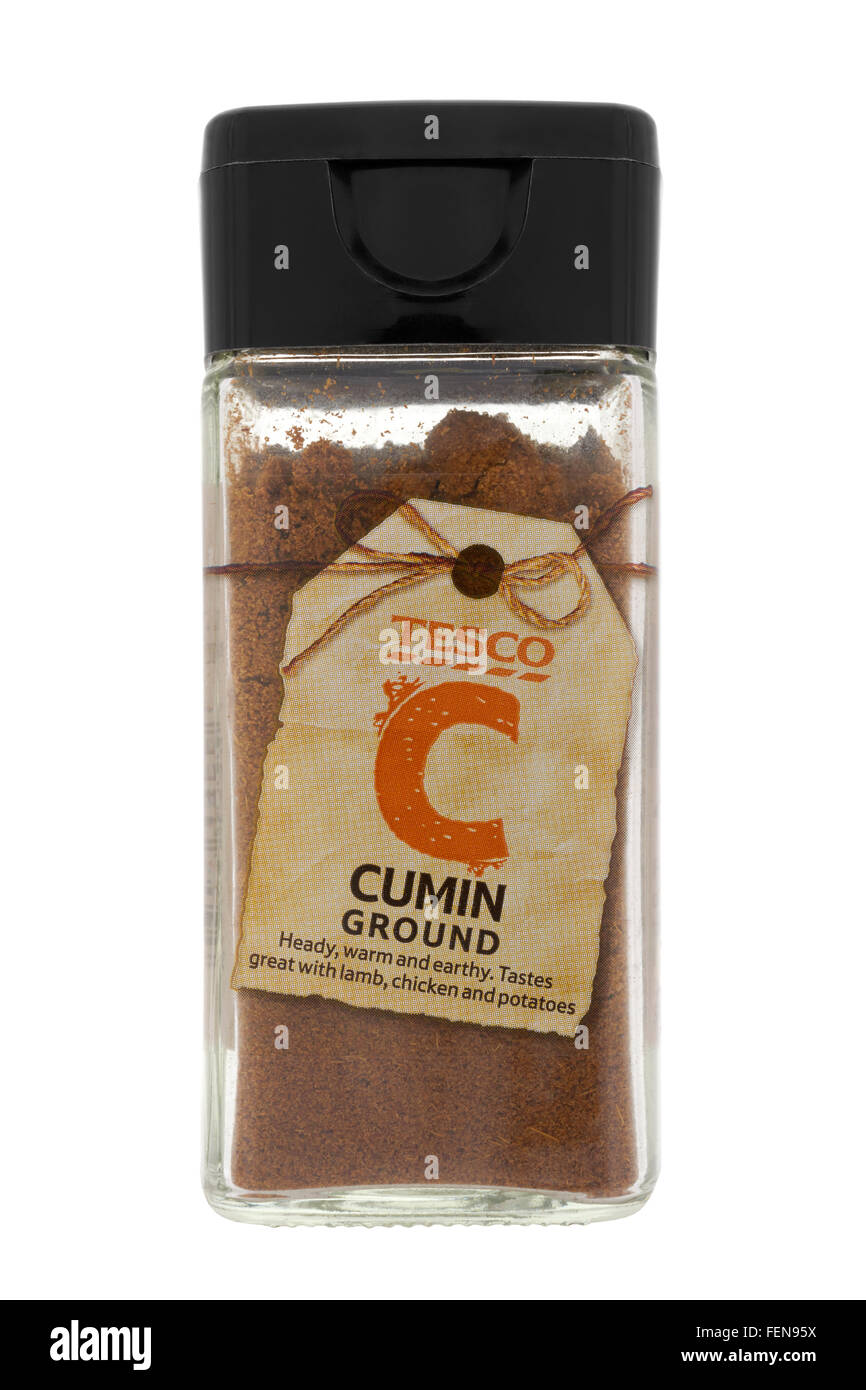 Jar of ground cumin on white background Stock Photo - Alamy