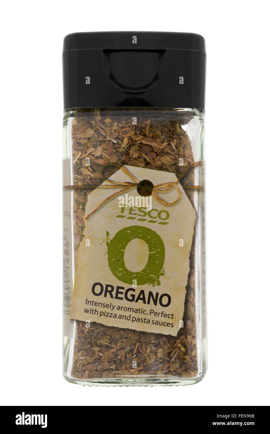 Jar of oregano on white background Stock Photo - Alamy