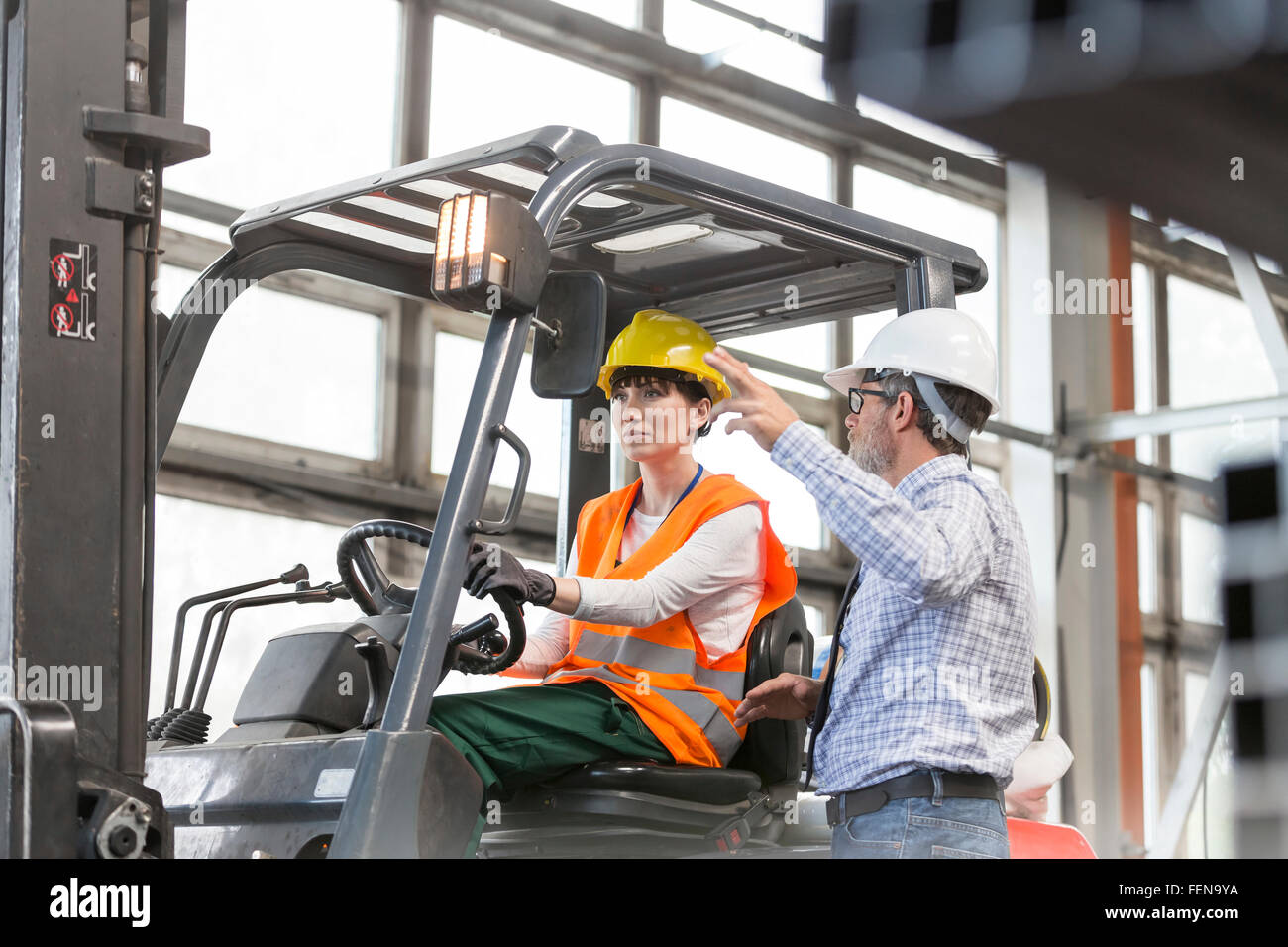 Woman driving forklift hi-res stock photography and images - Alamy