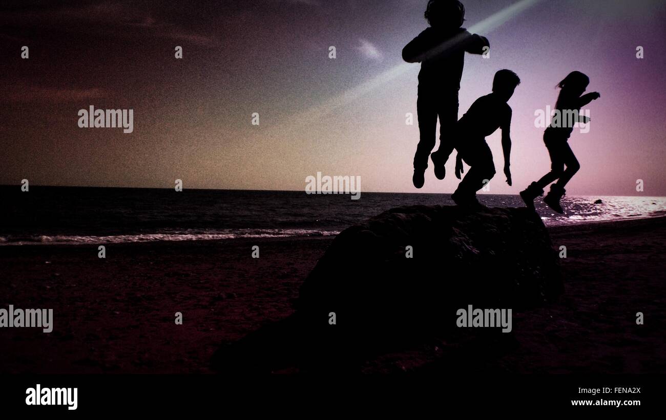 Children jumping into the sea hi-res stock photography and images - Alamy