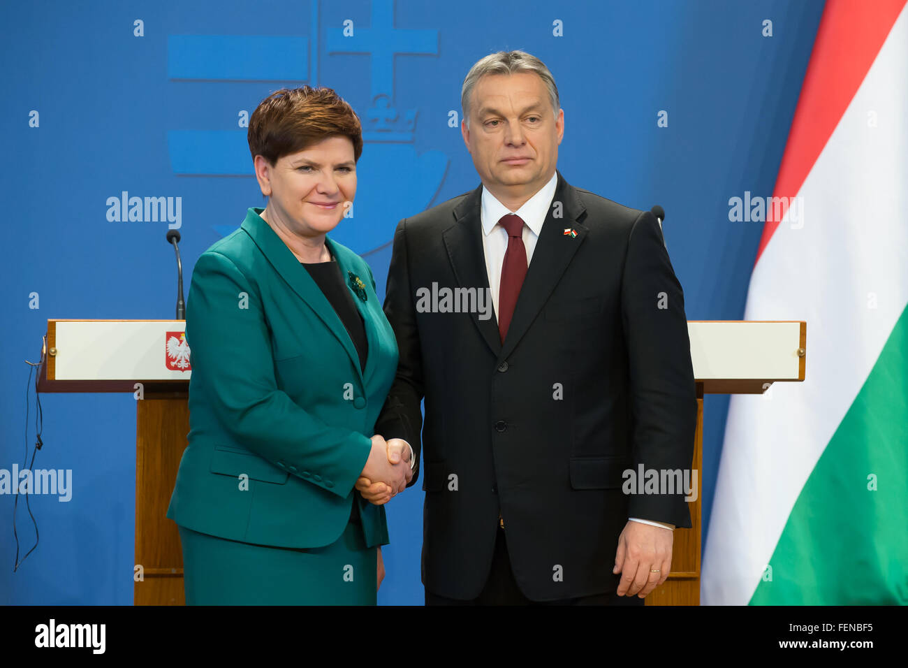 Budapest, Hungary. 8th Feb, 2016. Hungarian Prime Minister Viktor Orban (R) shakes hands with ...