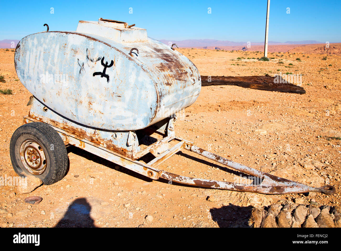water tank in morocco africa land gray metal weel and arid Stock Photo ...