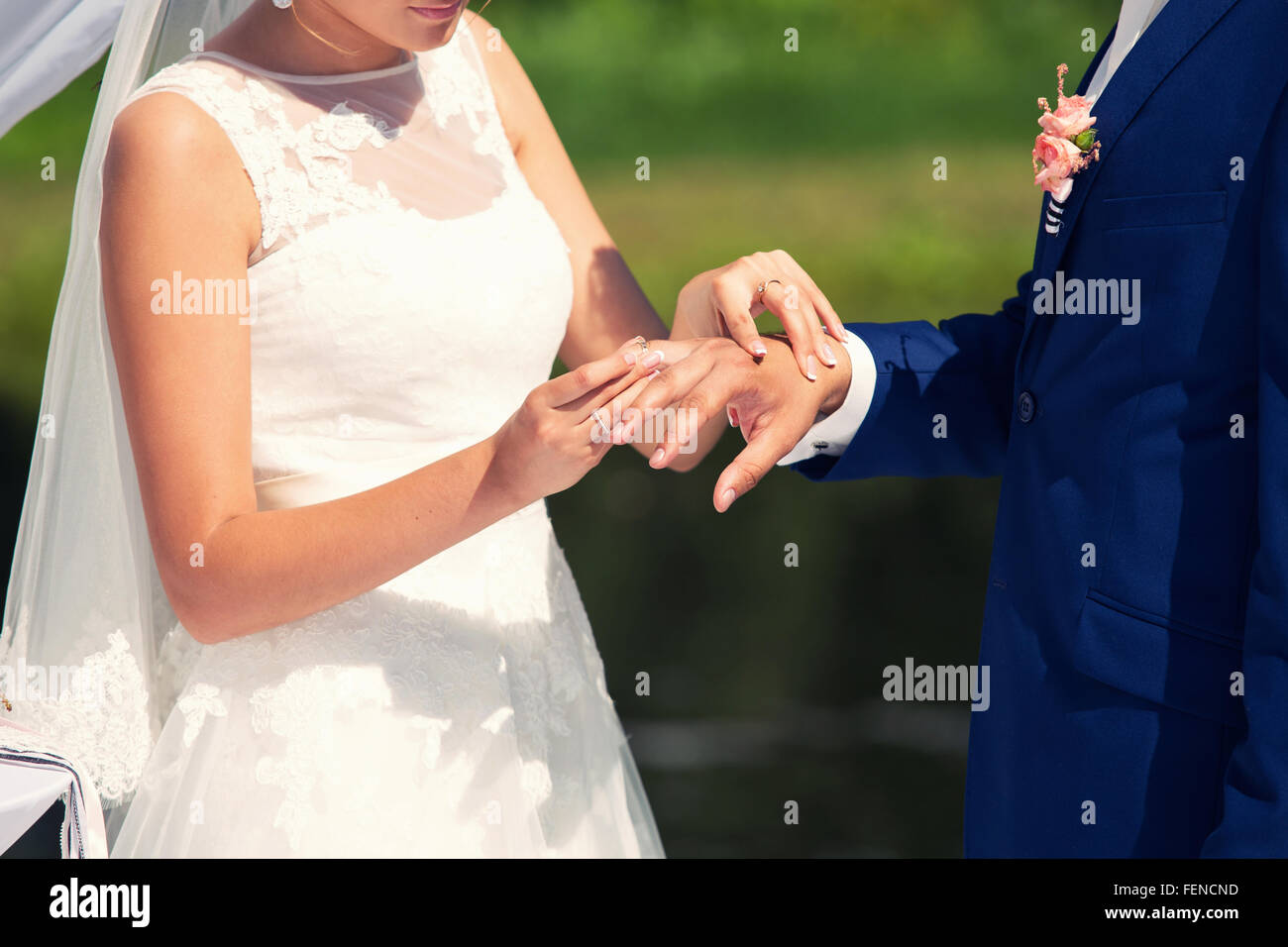 the groom dresses not weight a ring on a finger on wedding registration ...