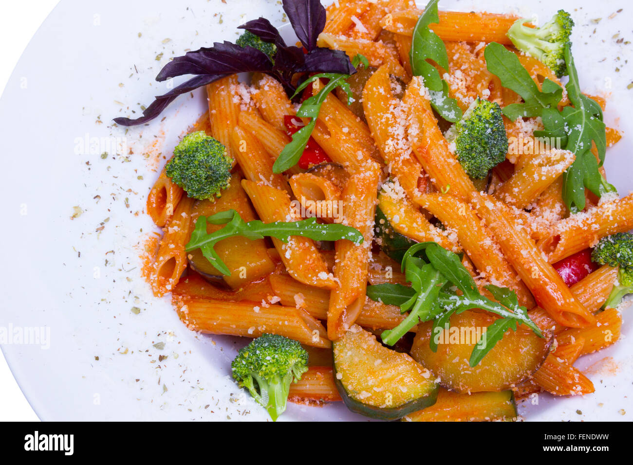 Red penne pasta with tomato sauce, broccoli, eggplant, paprika and ...