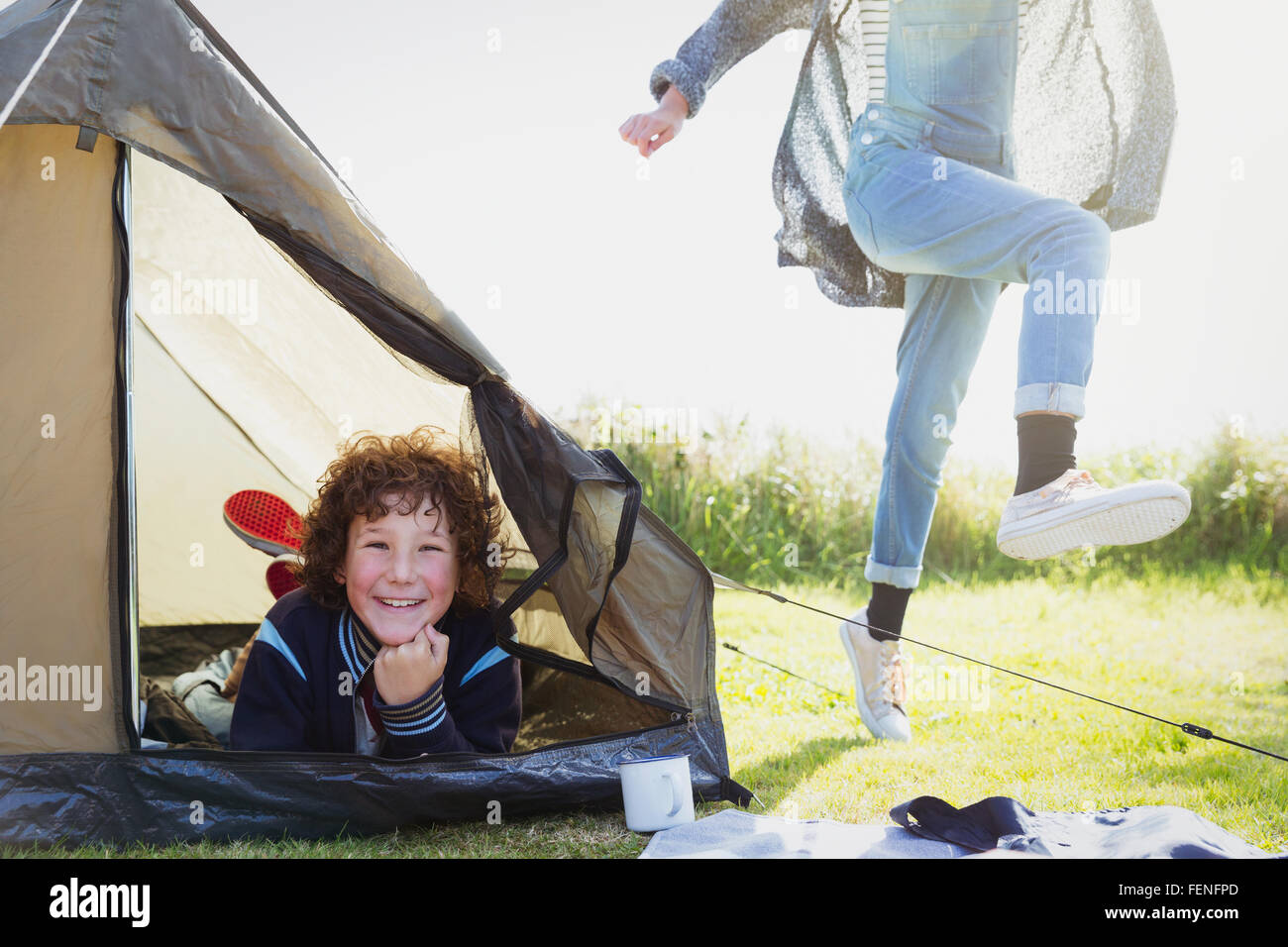 Portrait smiling boy inside tent Stock Photo - Alamy