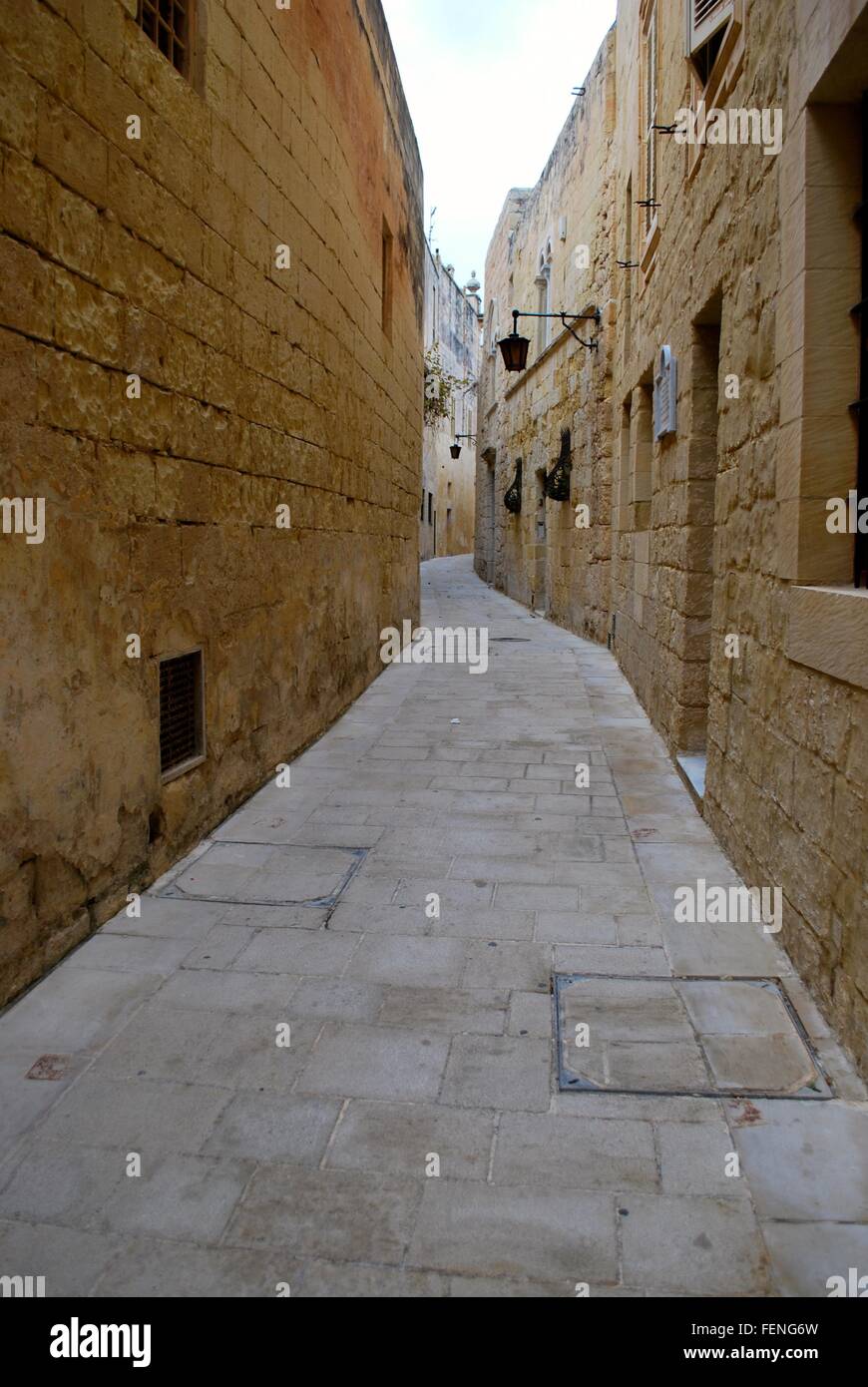 Narrow Pathway Along Built Structures Stock Photo - Alamy