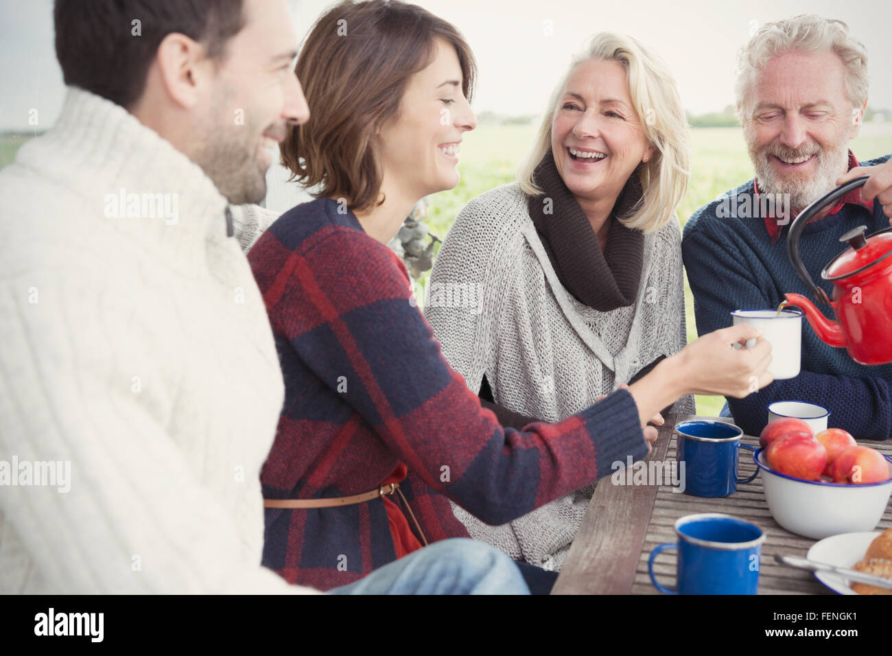 Couples drinking coffee on patio Stock Photo - Alamy