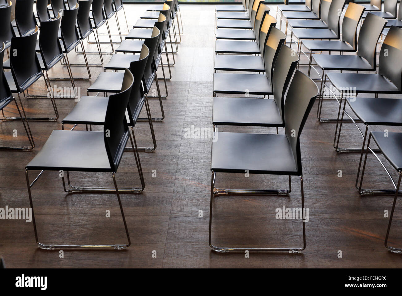 Rows of empty chairs prepared for an indoor event Stock Photo - Alamy