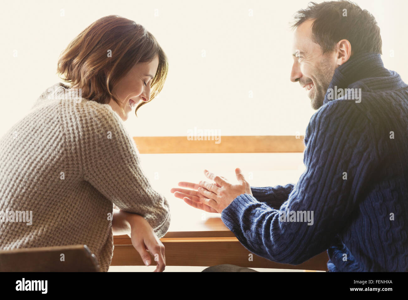 Couple sitting side by side at table hi-res stock photography and ...