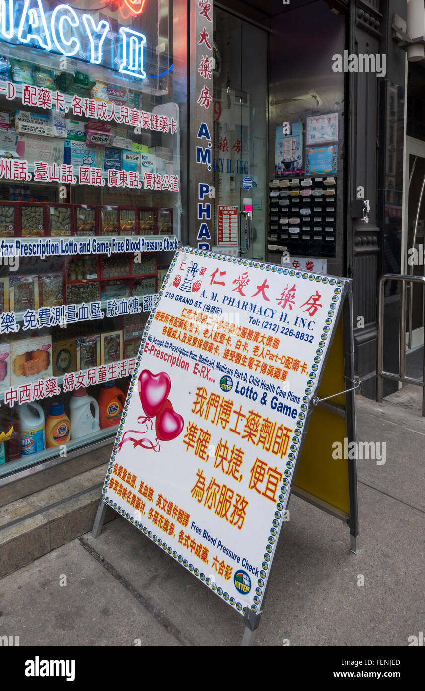 Folding sign outside a pharmacy in Chinatown in New York City Stock ...