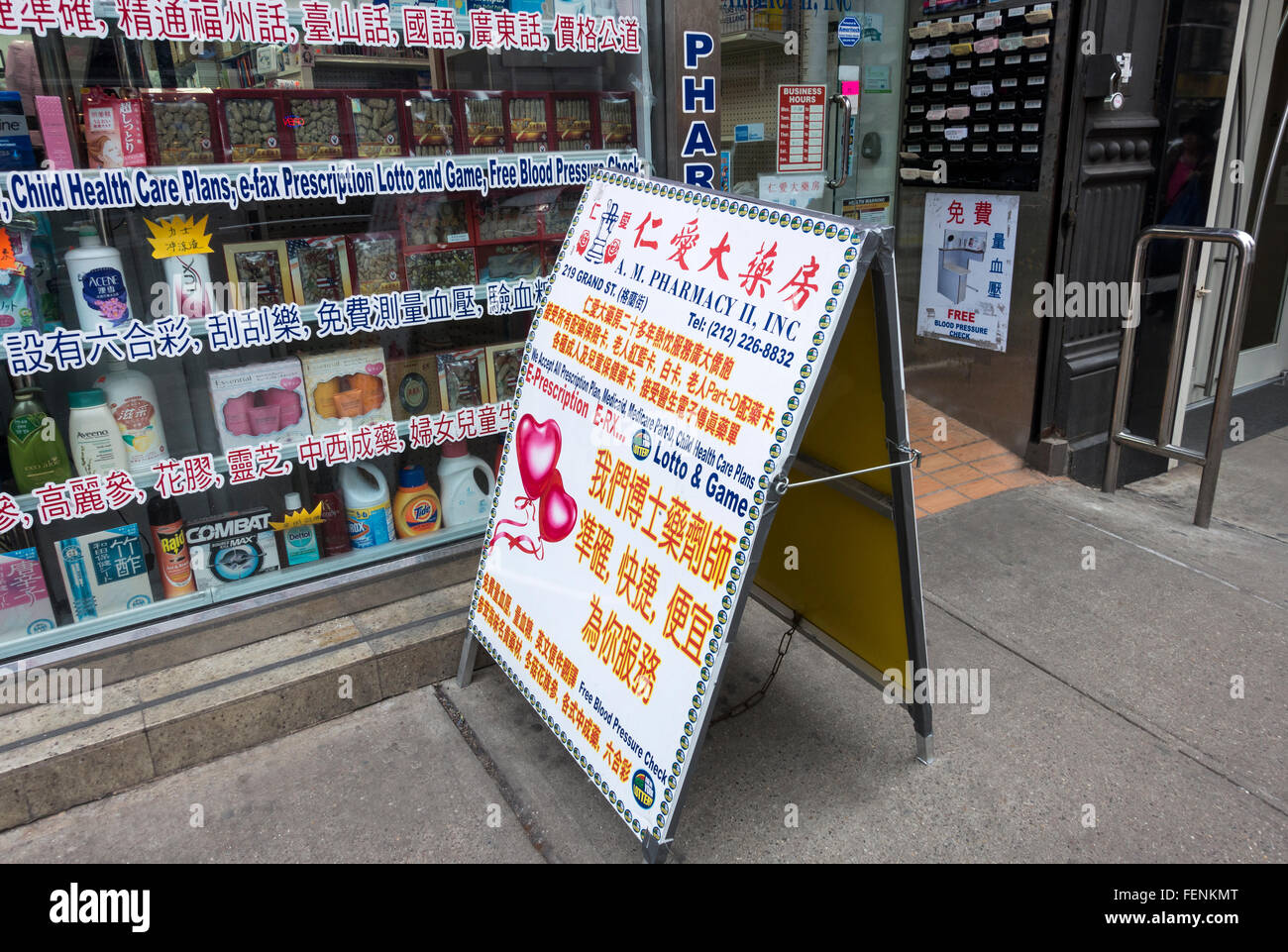 Folding sign outside a pharmacy in Chinatown in New York City Stock ...