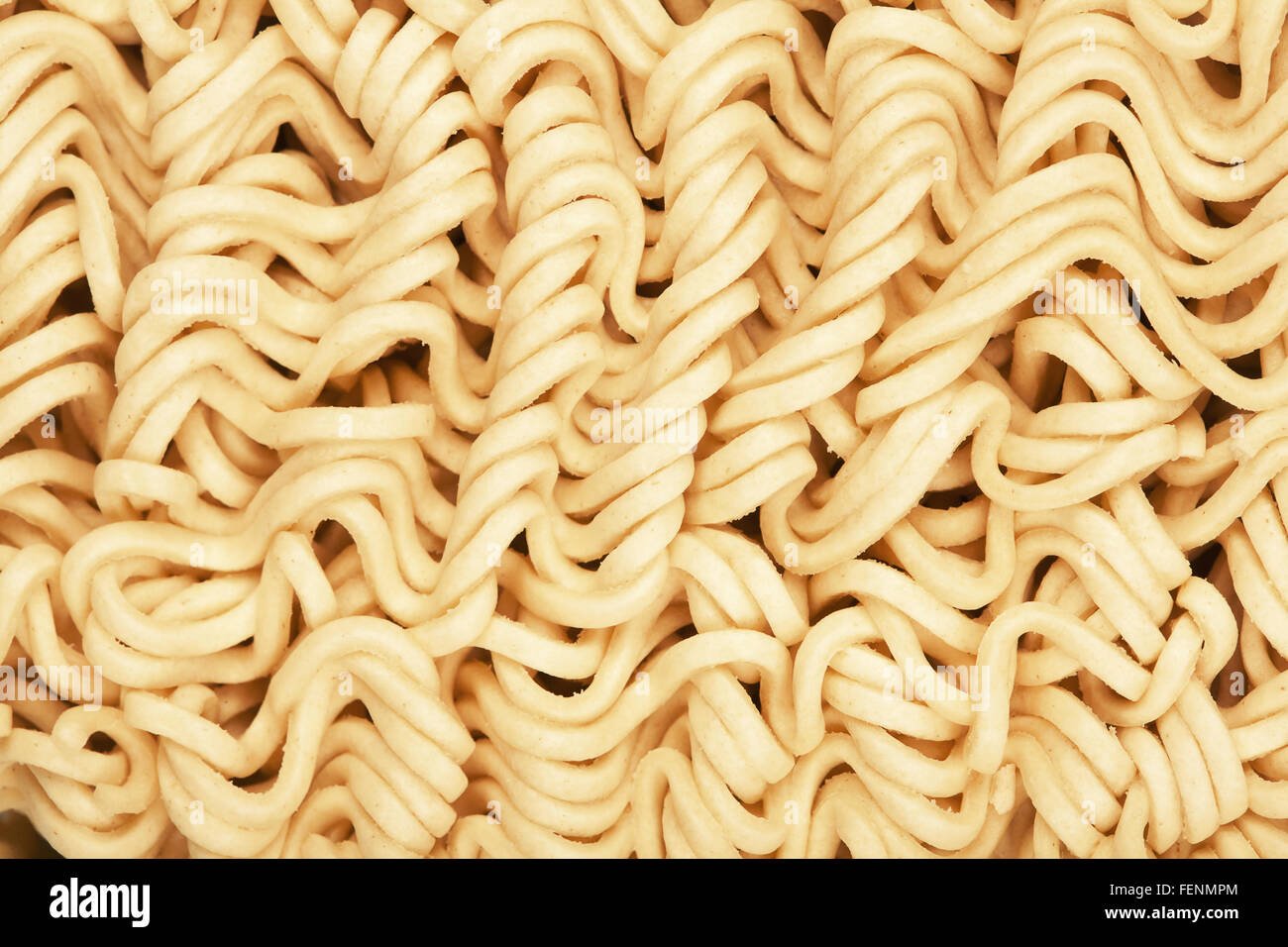 Close up shot of yellow instant noodles texture Stock Photo - Alamy