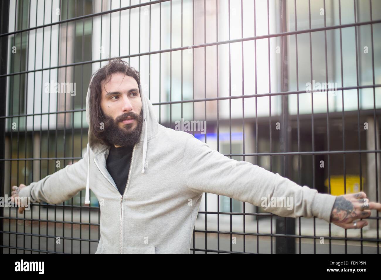 Man leaning against fence hi-res stock photography and images - Alamy