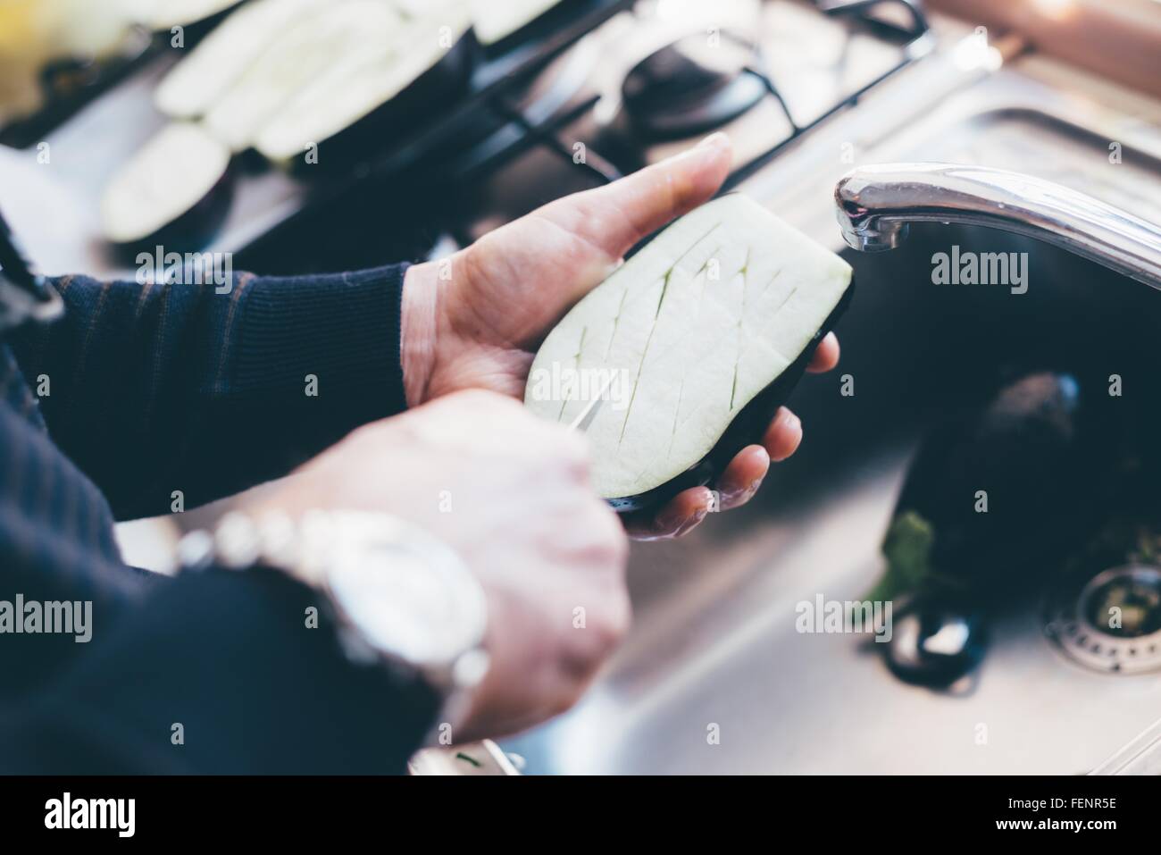 Hands using kitchen knife cutting hi-res stock photography and images ...