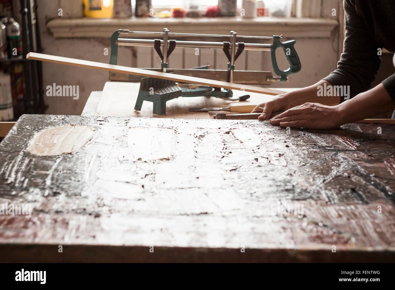 Male artist, framing artwork, close-up Stock Photo - Alamy