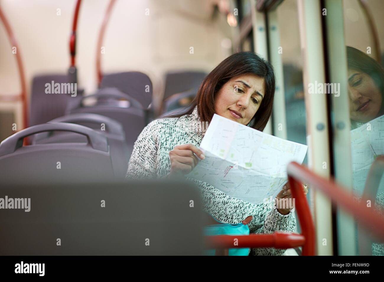 Mature woman sitting on bus hi-res stock photography and images - Alamy