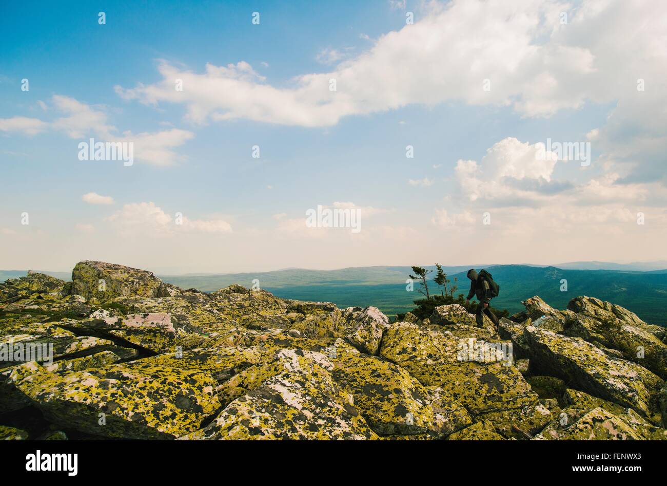 Male hiker hiking on rocks in rugged landscape, Russia Stock Photo - Alamy
