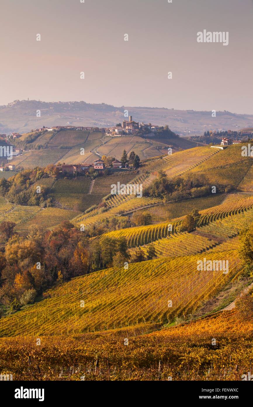 Landscape with autumn vineyards and hill village, Langhe, Piedmont ...