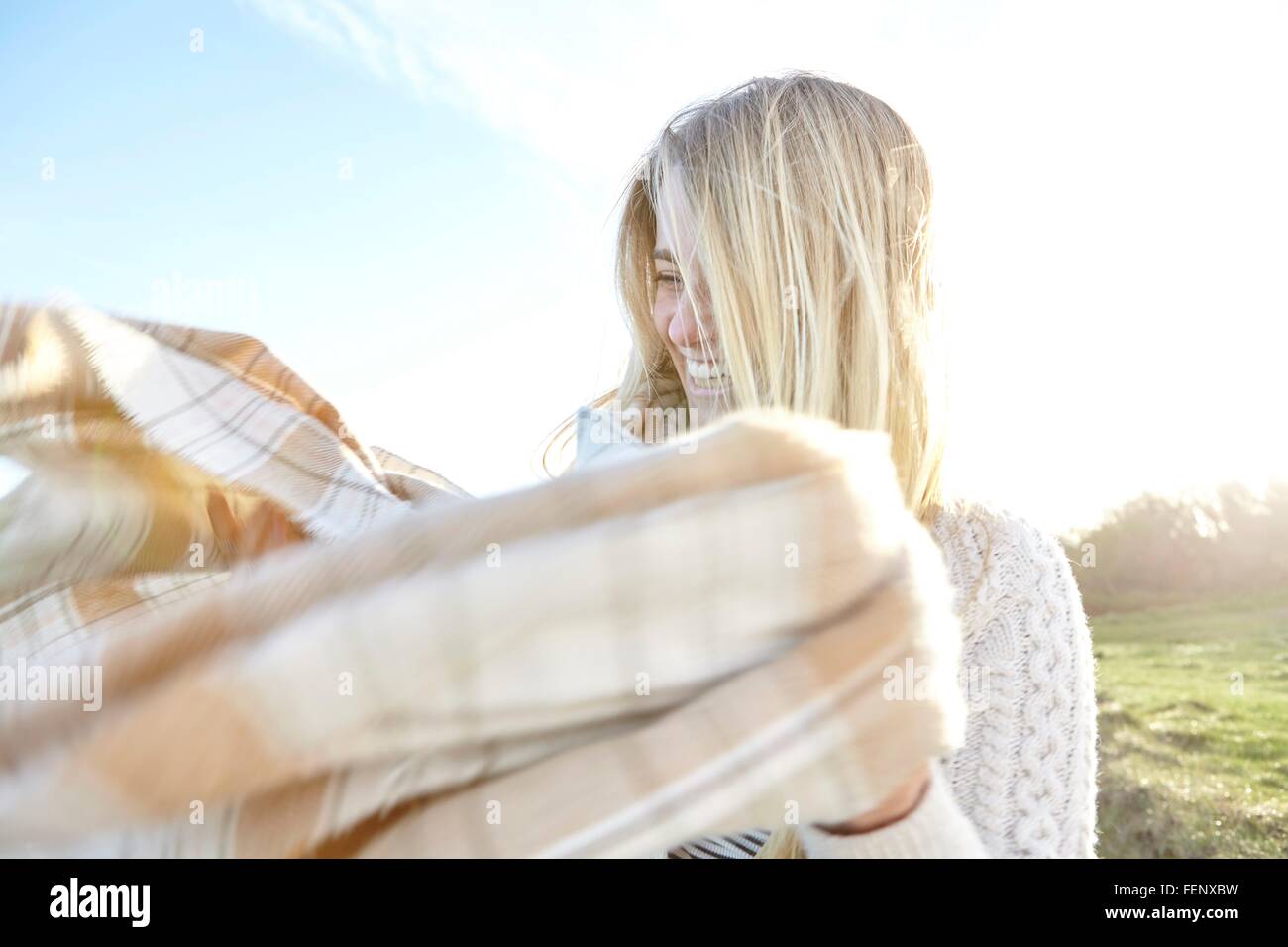 Carefree young woman wind blown hi-res stock photography and images - Alamy