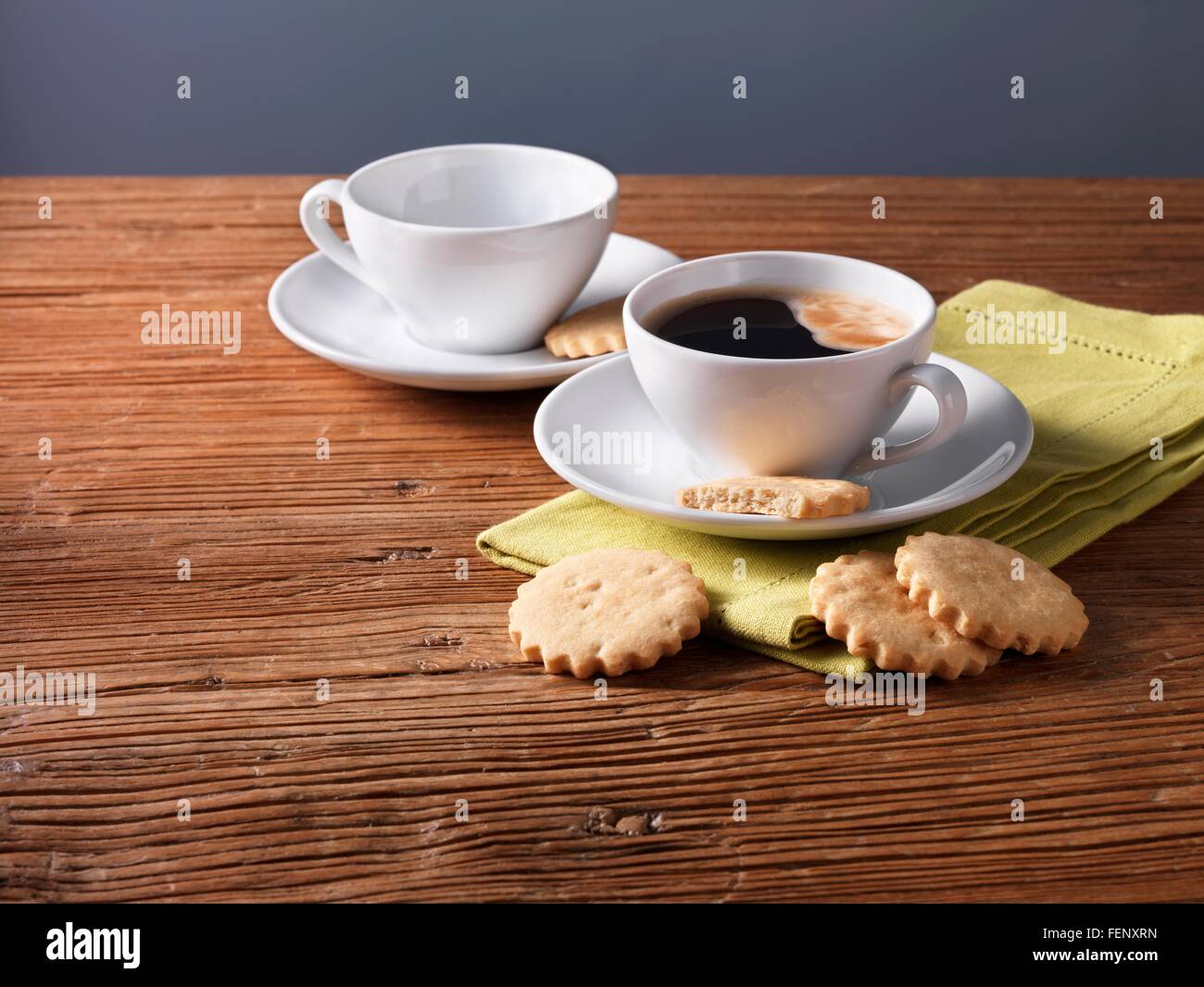 Black coffee and almond biscuits on wood table Stock Photo - Alamy
