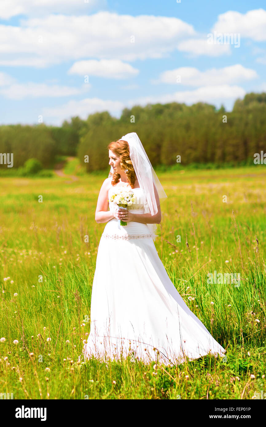 Lovely bride outdoors in a forest Stock Photo - Alamy
