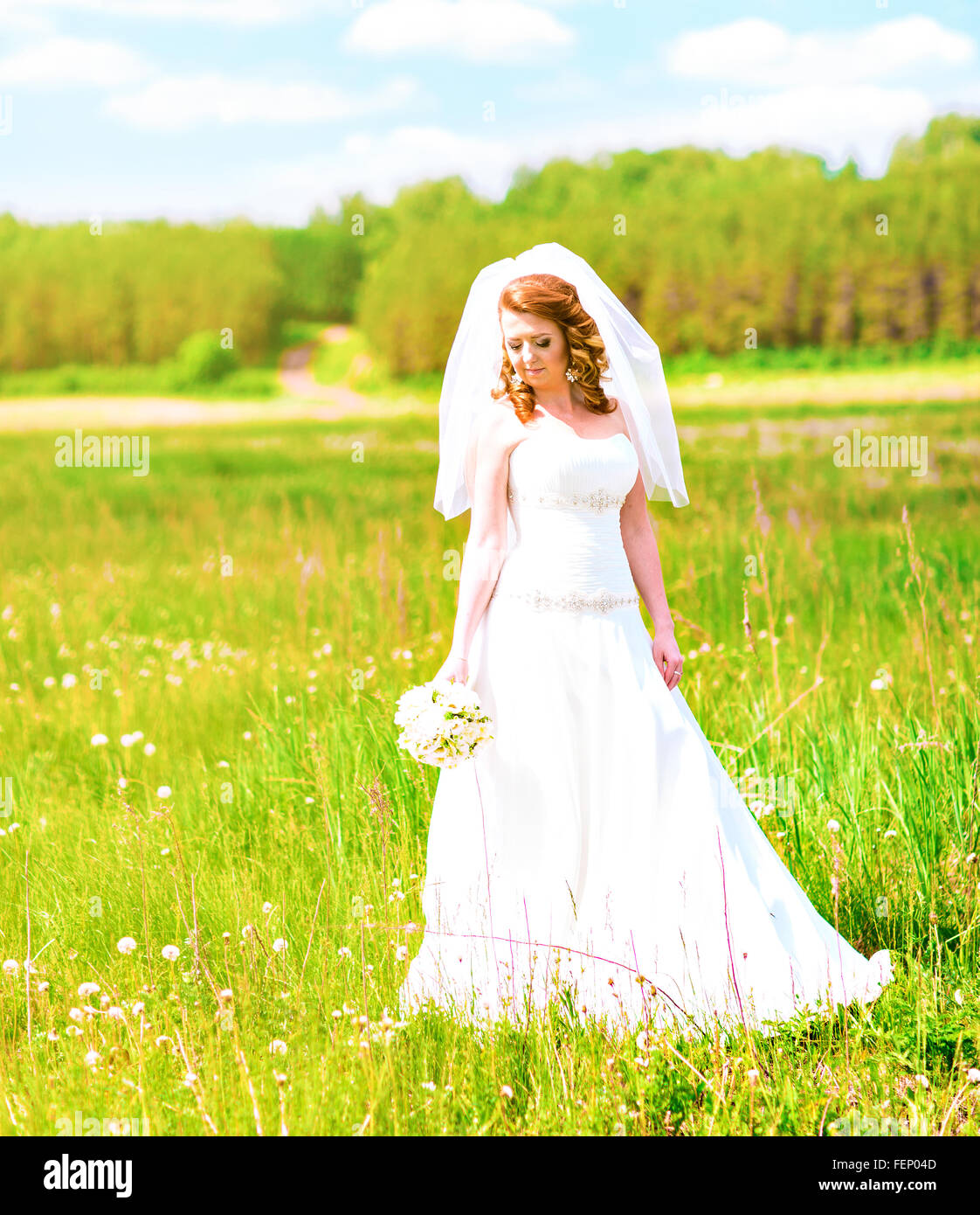 Lovely bride outdoors in a forest Stock Photo - Alamy