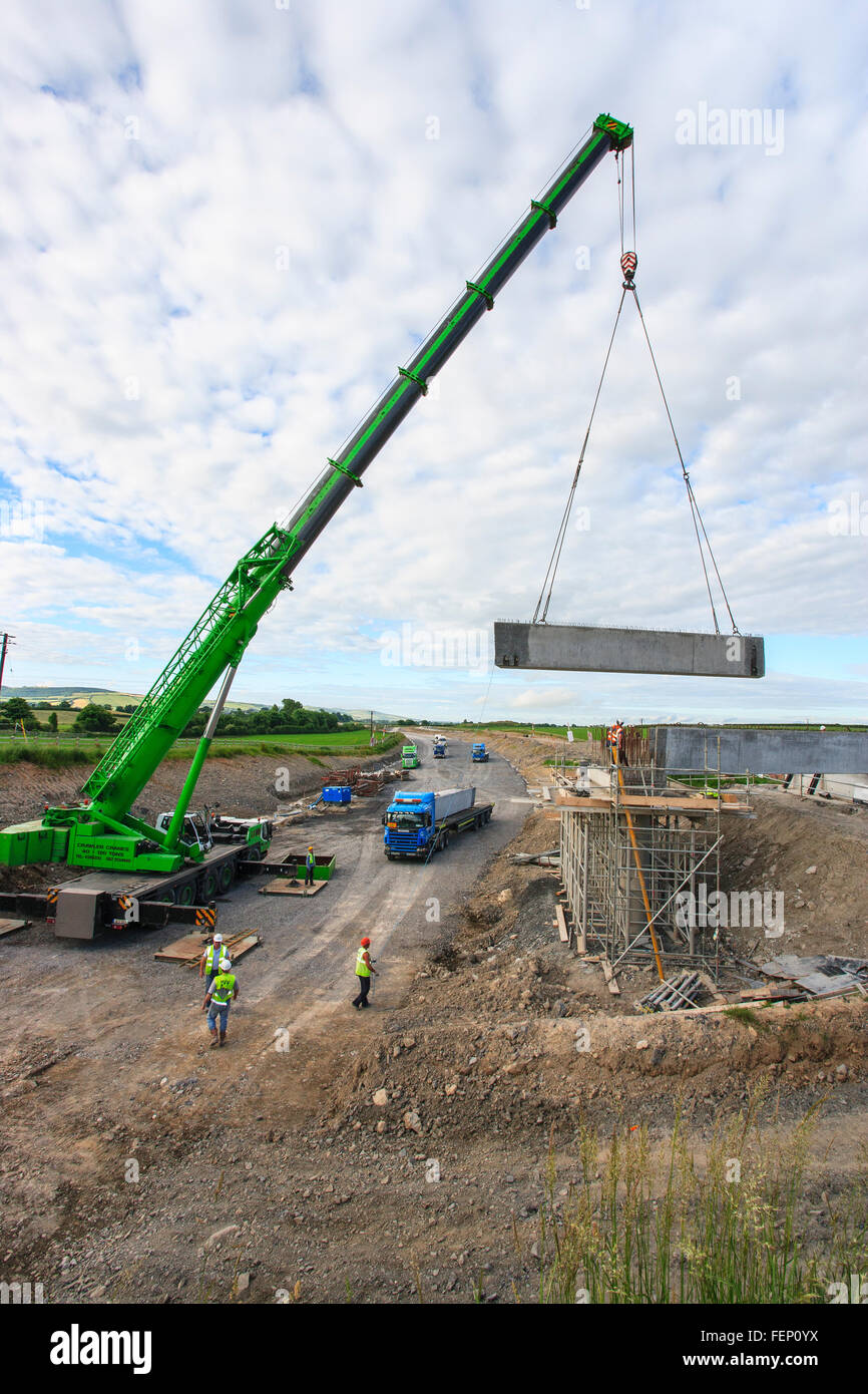 Construction crane lifting precast concrete hi-res stock photography ...