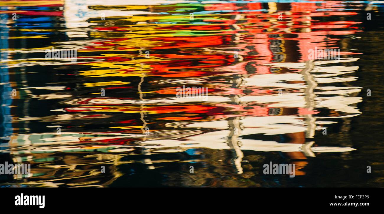 Colourful reflections in water Stock Photo - Alamy