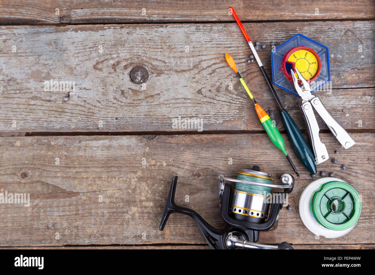 fishing tackles for anglers - swimmers, plummets and tools on wooden ...