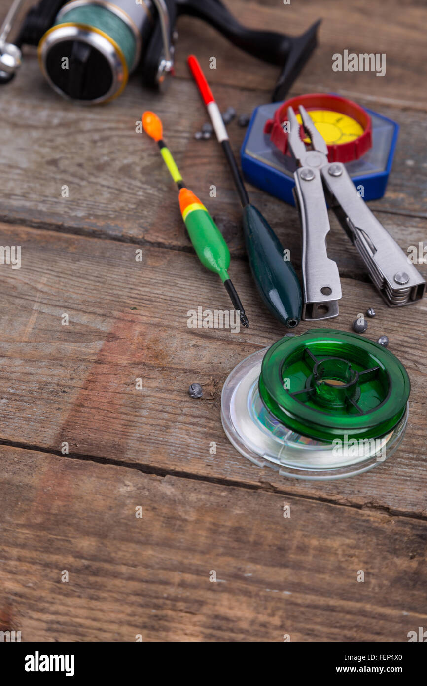 fishing tackles for anglers - swimmers, plummets and tools on wooden ...