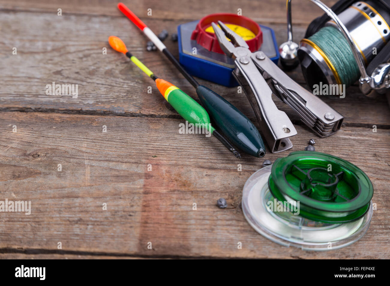 fishing tackles for anglers - swimmers, plummets and tools on wooden ...