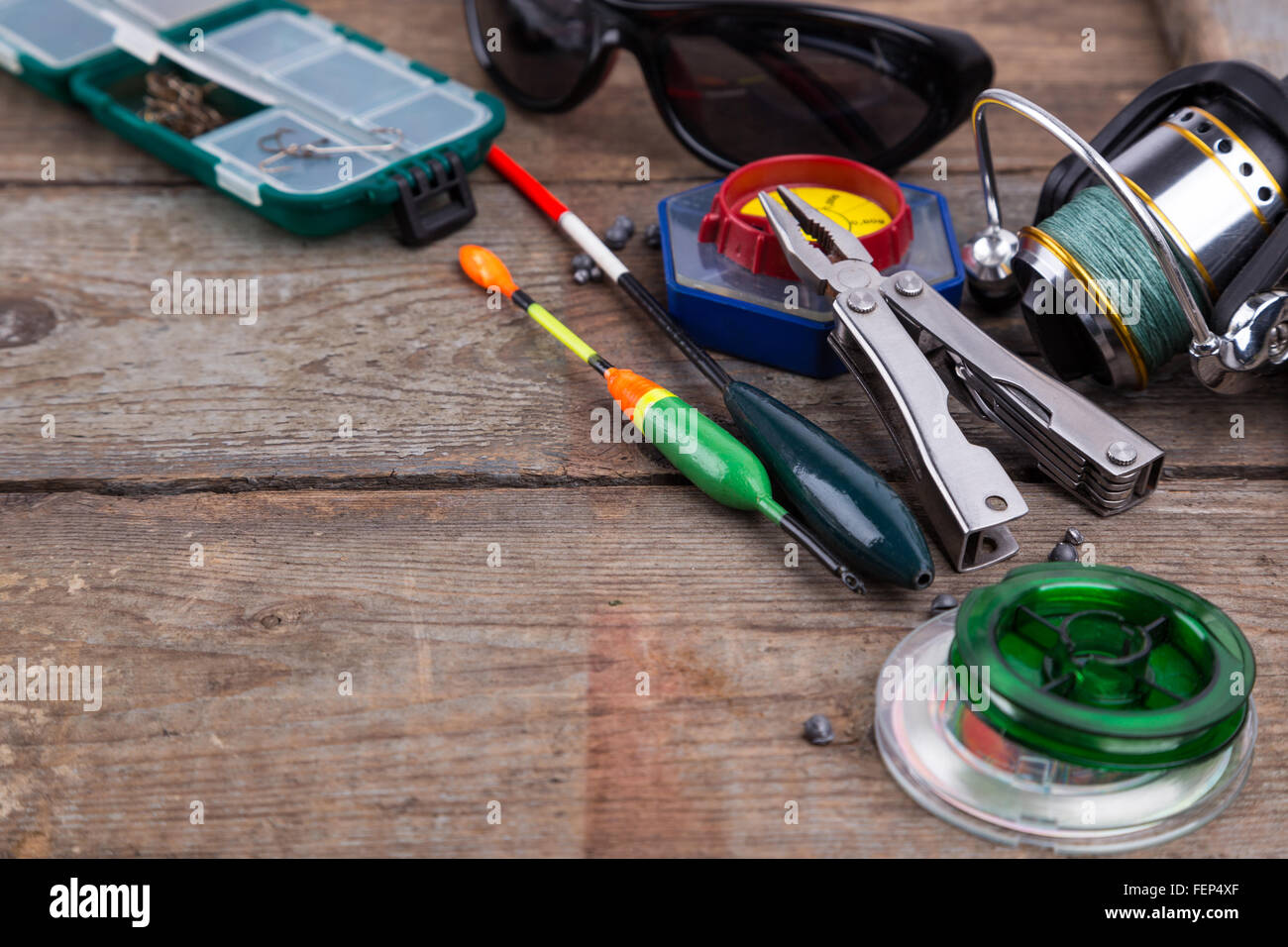 fishing tackles for anglers - swimmers, plummets and tools on wooden ...