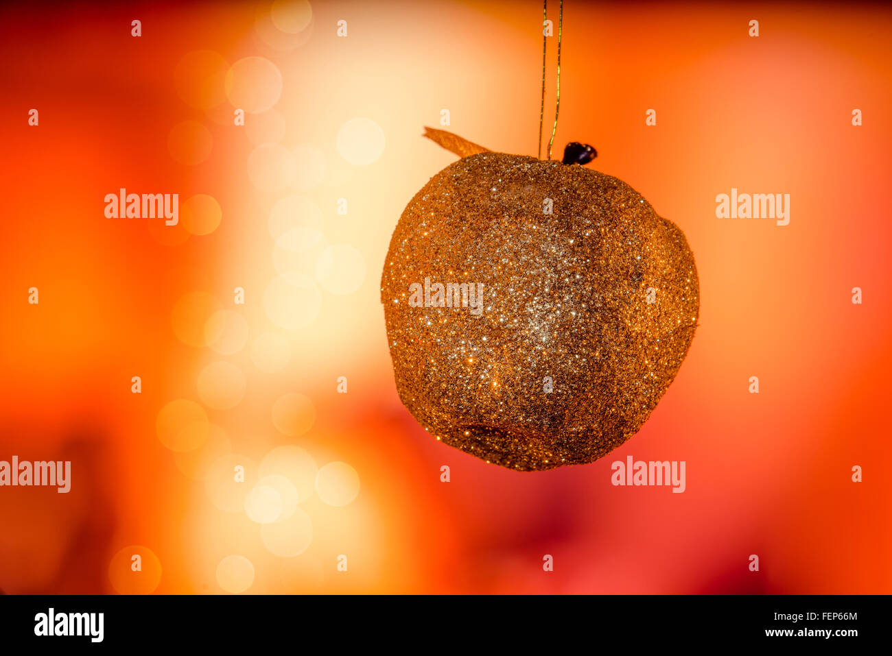 Golden Christmas apple with glittering bokeh lights Stock Photo - Alamy