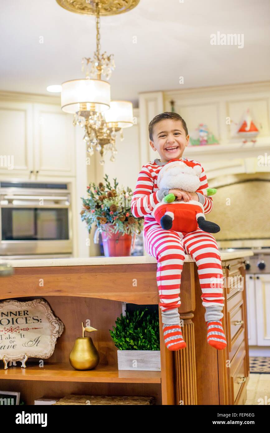 Boy sitting on counter hi-res stock photography and images - Alamy