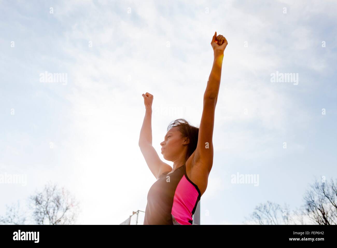 Action arms raised celebrating sport hi-res stock photography and ...