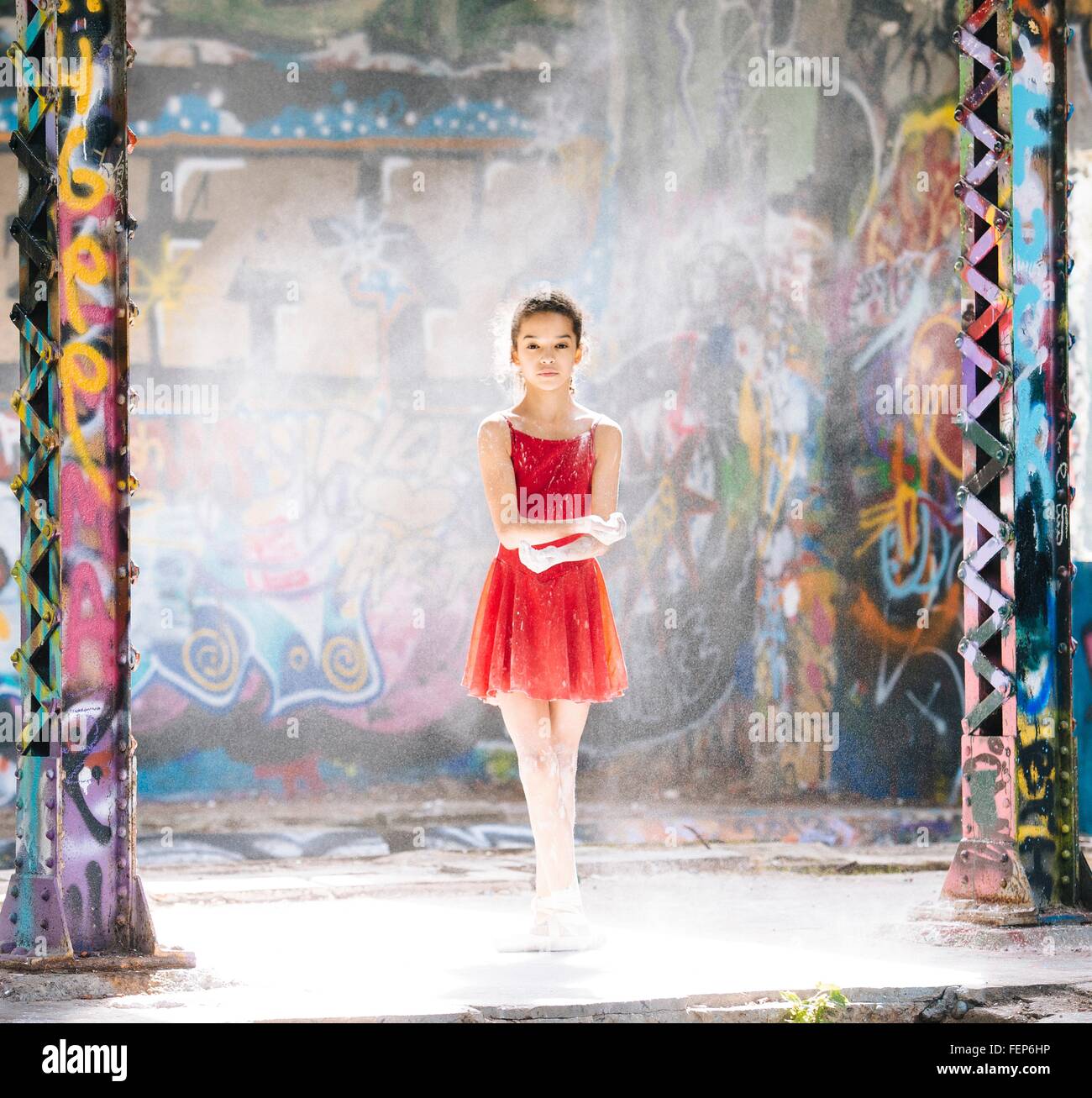 Portrait of ballet dancer girl covered in white powder in front of ...