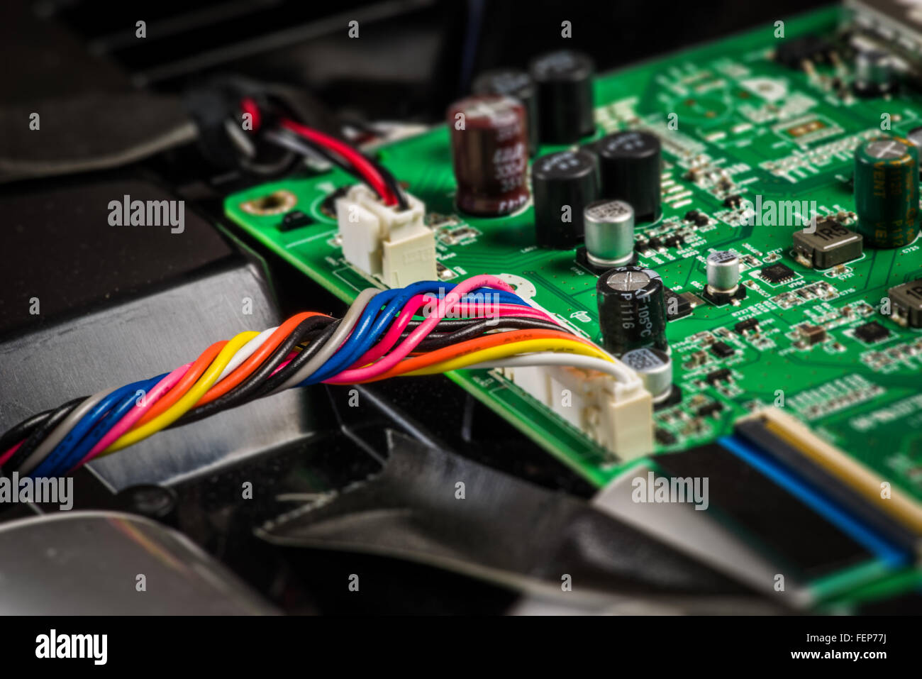 Wires in various colors on a motherboard Stock Photo - Alamy