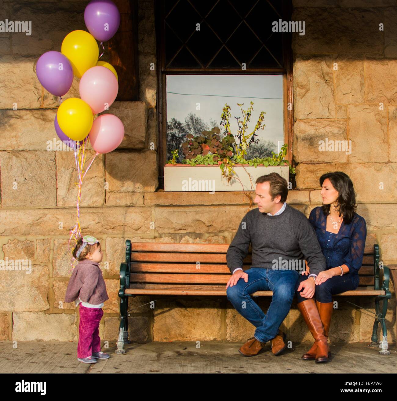Girl sitting balloons hi-res stock photography and images - Alamy