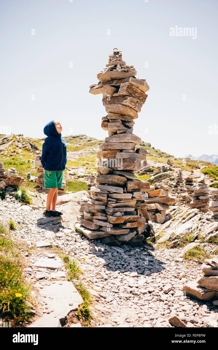 Child stacking rocks hi-res stock photography and images - Alamy