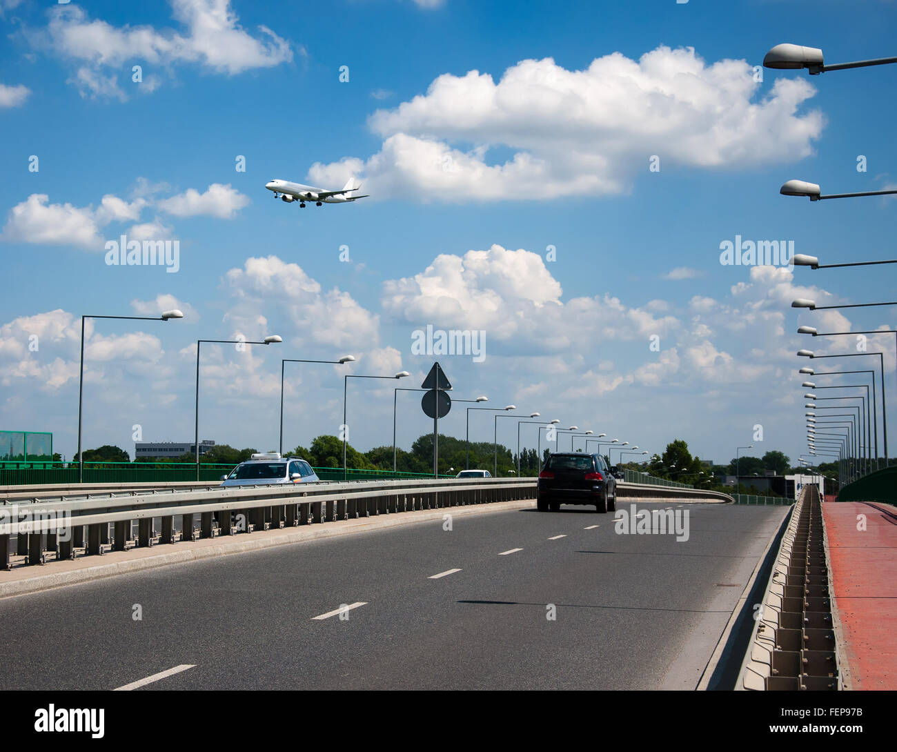 Plane over road hi-res stock photography and images - Alamy