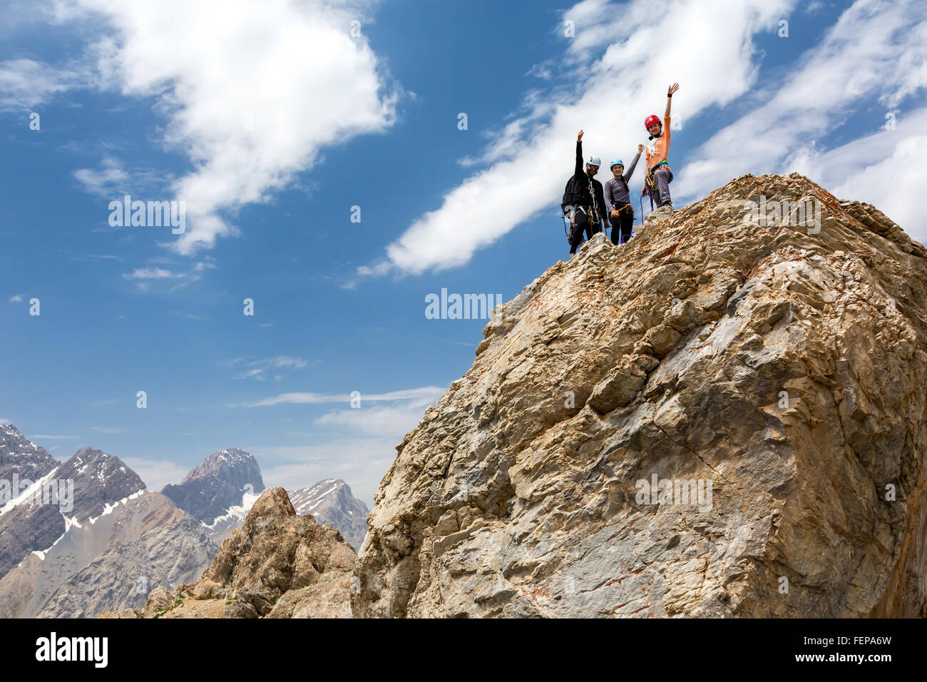 Climbers on summit Stock Photo - Alamy