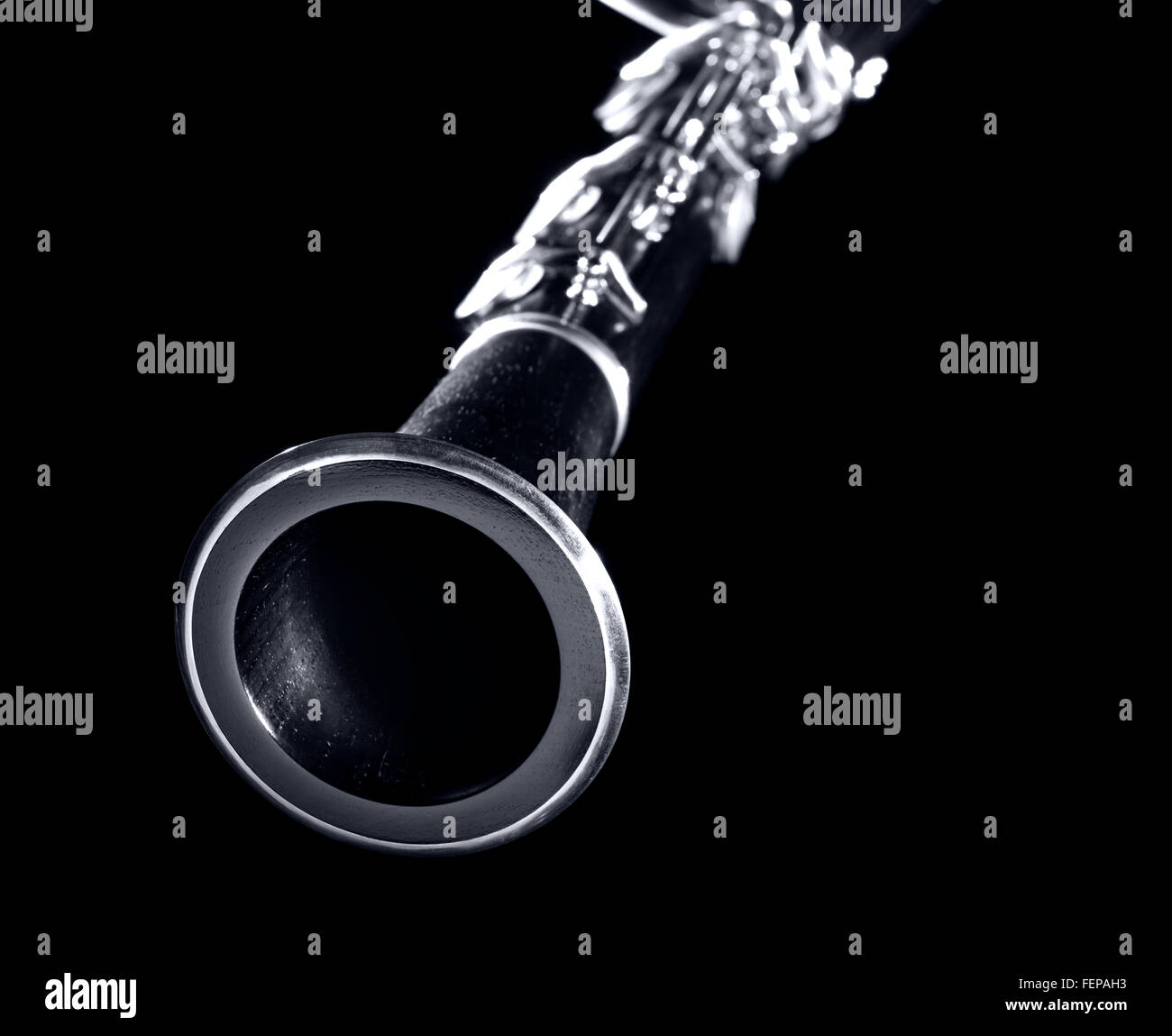 clarinet closeup with blurry body on a black background, composition ... clarinet closeup with blurry body on a black background, composition ...