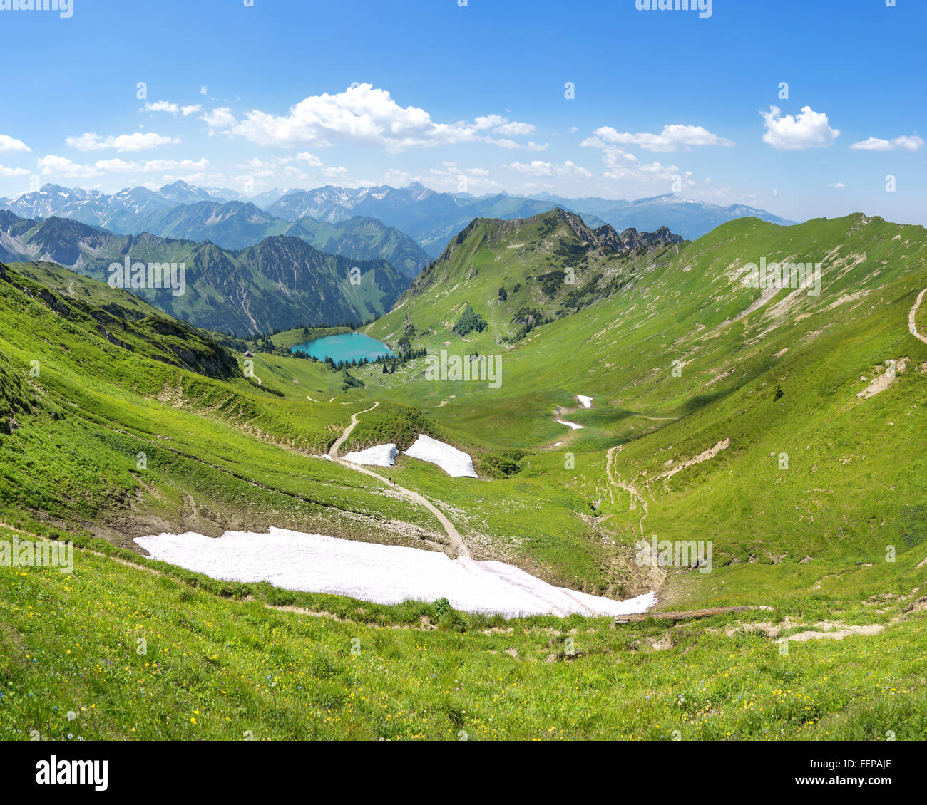 Last snow remains in the summer Allgau Alps with lake Seealpsee. Taken ...
