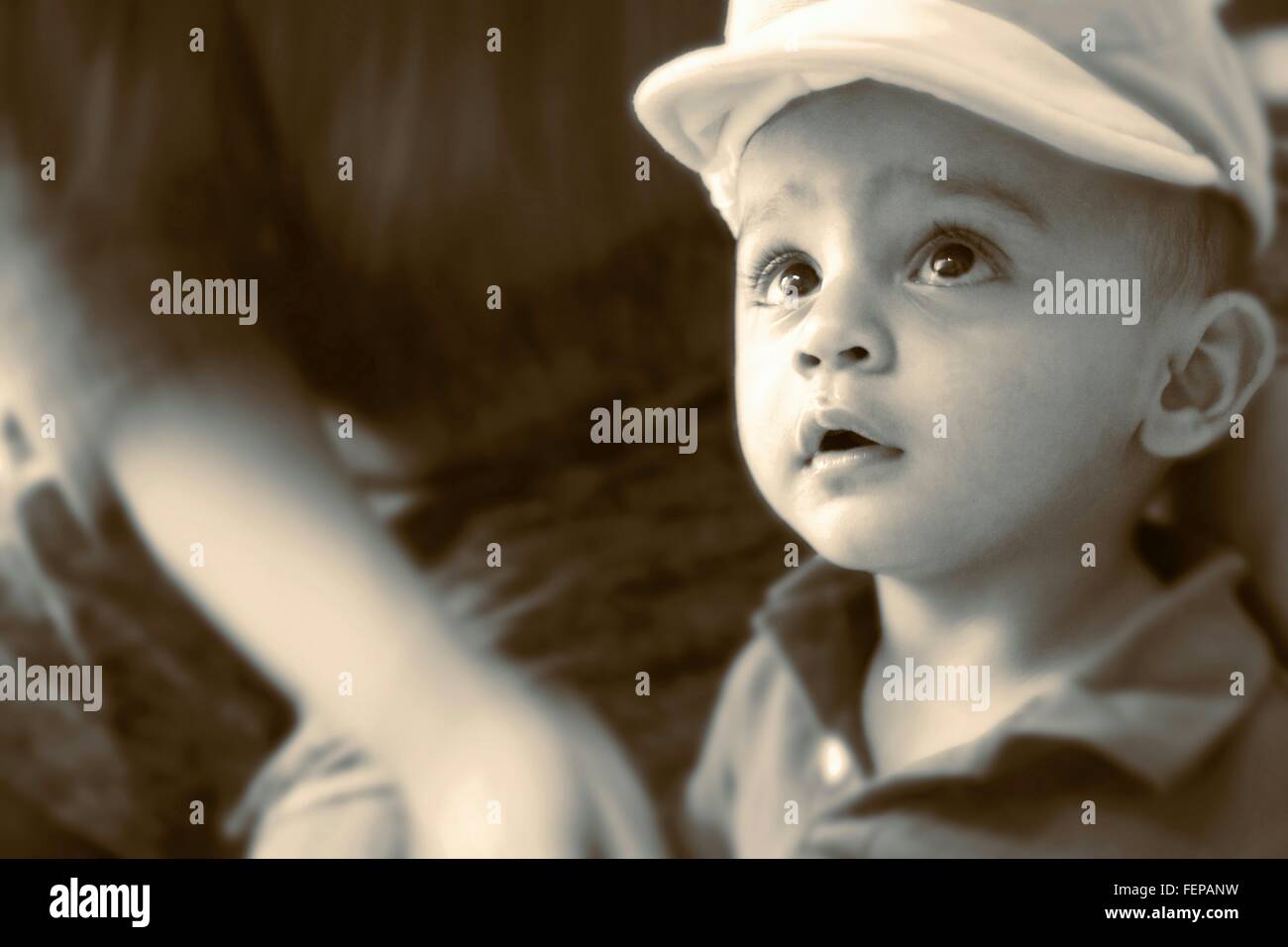Close-Up Of Cute Boy Looking Up Stock Photo - Alamy
