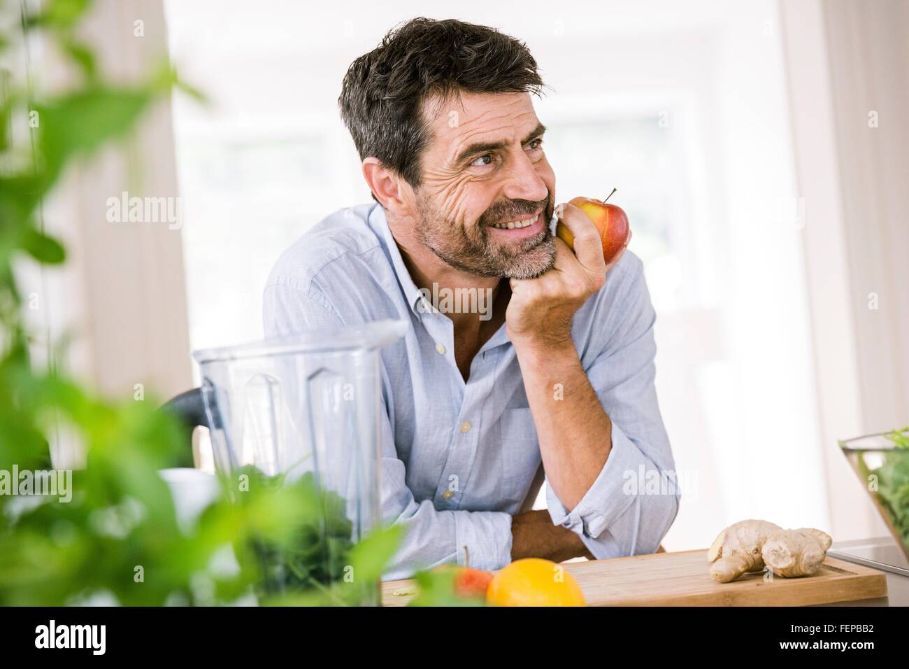 Male eating an apple hi-res stock photography and images - Alamy