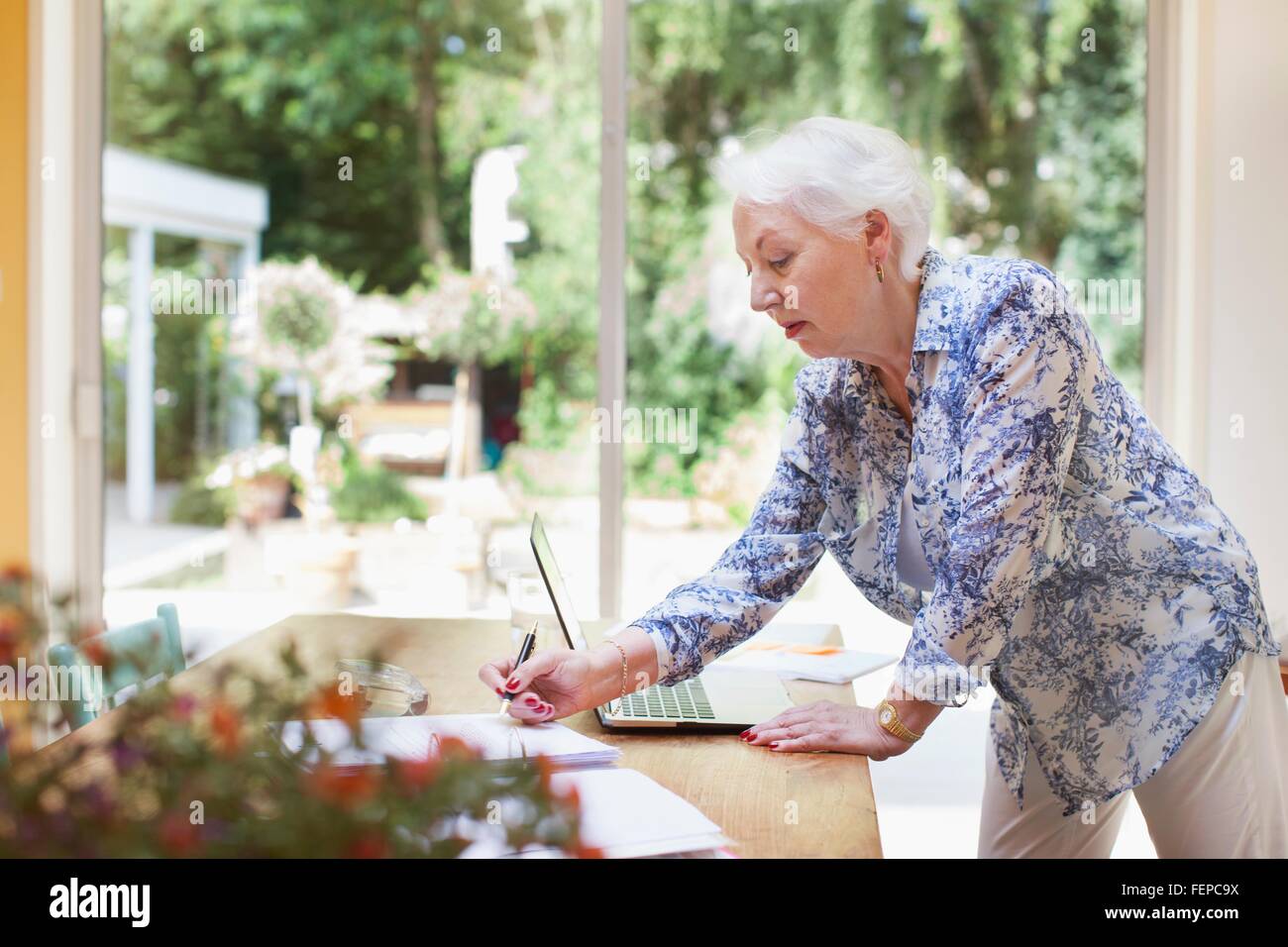 Senior woman notebook hi-res stock photography and images - Alamy