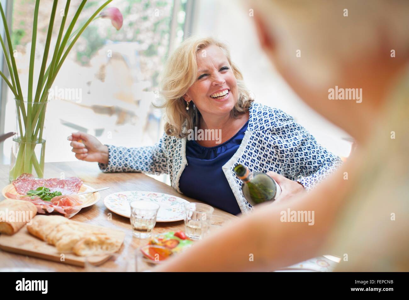 Two women having lunch together, at home Stock Photo - Alamy